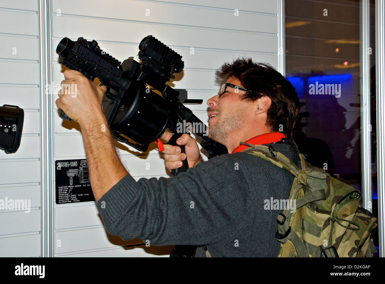 Attendee 2013 Las Vegas SHOT Show trying Mikor MSGL-105 six-shot 40 ...
