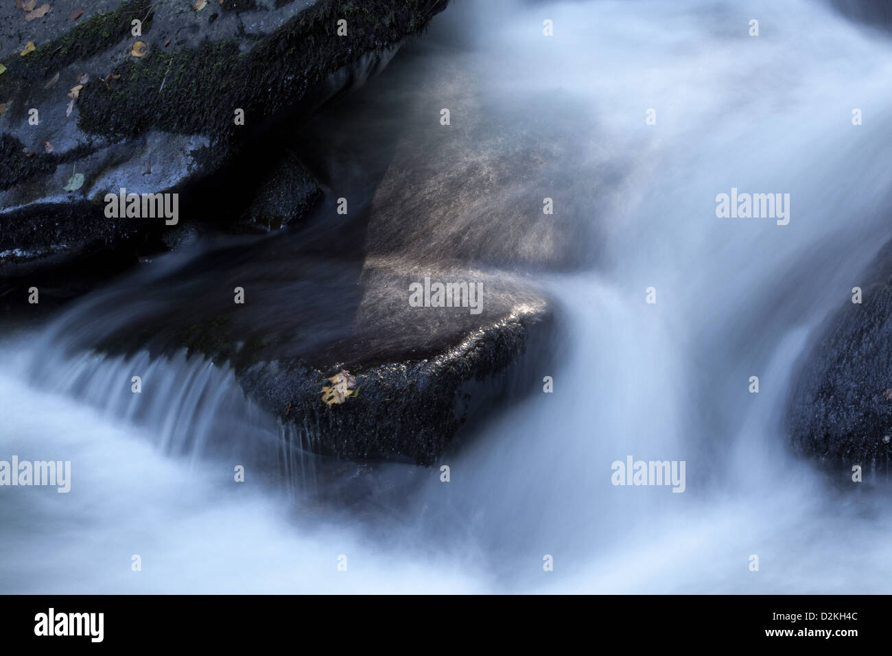 Blue Water over Rocks Stock Photo - Alamy