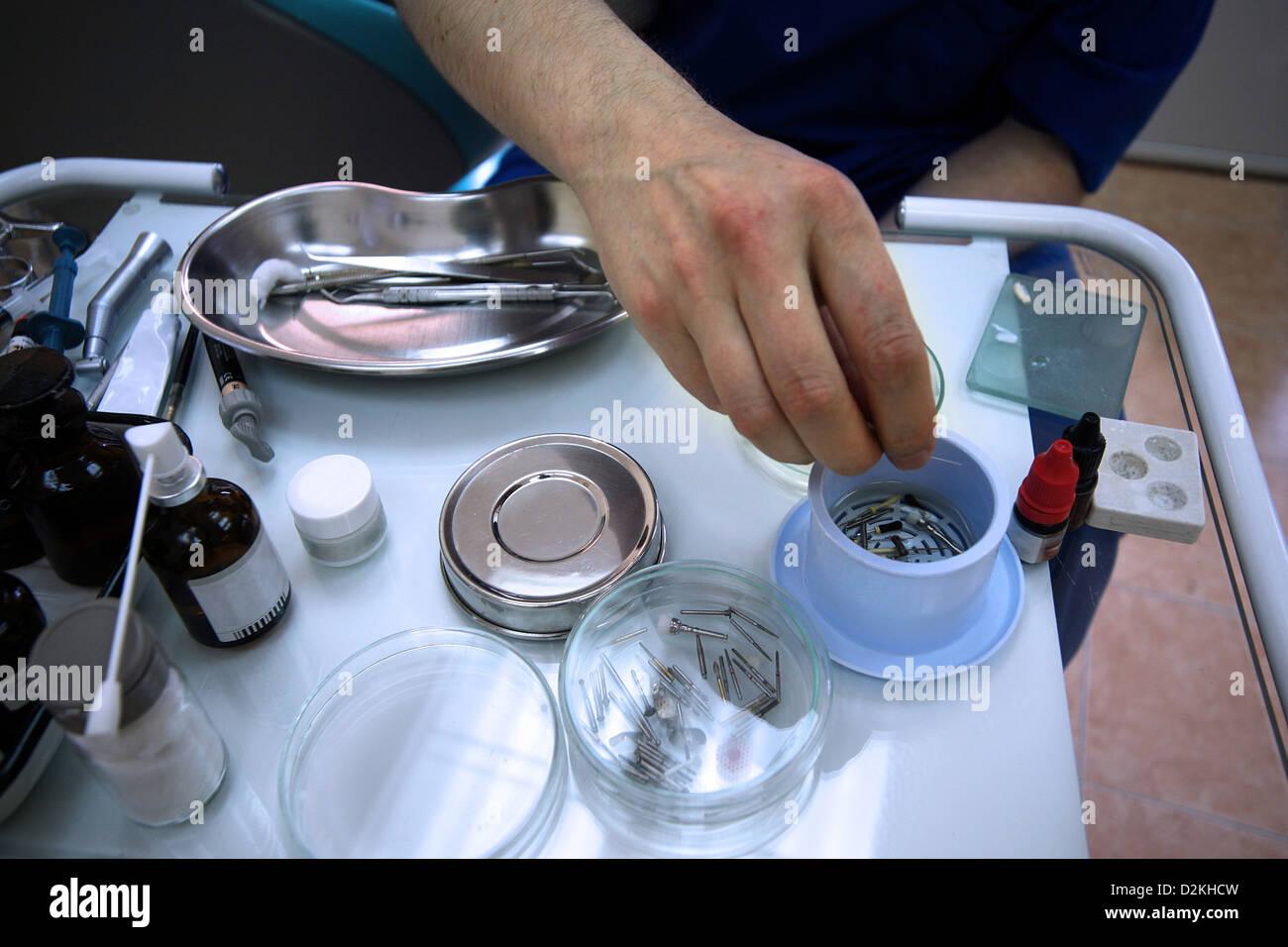 The doctor in stomatological office. On the advanced sharp plan ...