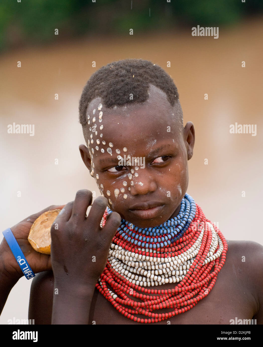 Portrait of decorated Kara woman being painted by other Stock Photo - Alamy