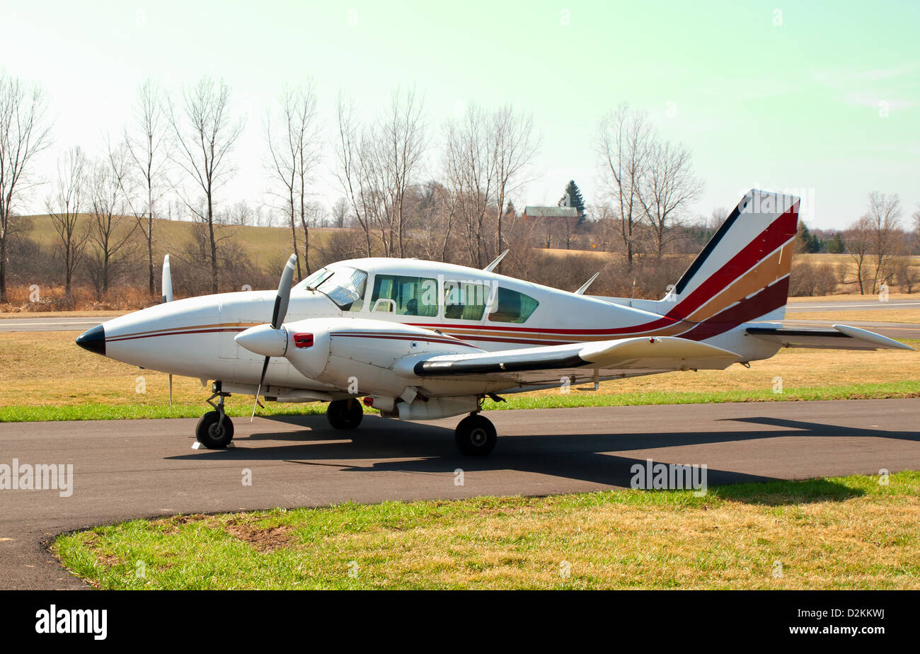 small Aztec passenger plane parked at a country runway Stock Photo - Alamy