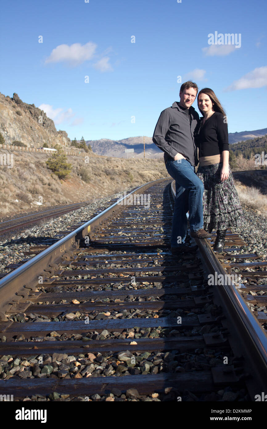 Couple walking on a train track hi-res stock photography and images - Alamy