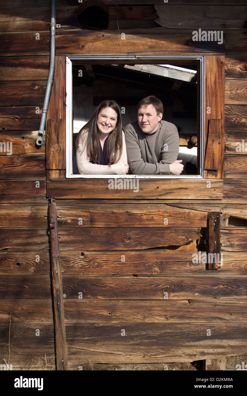 a young couple in love by an old barn Stock Photo - Alamy