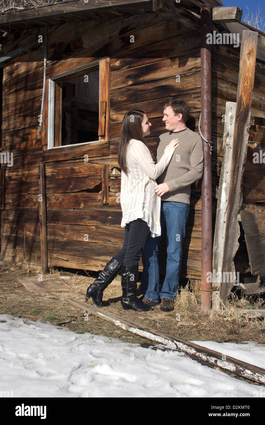 a young couple in love by an old barn Stock Photo - Alamy