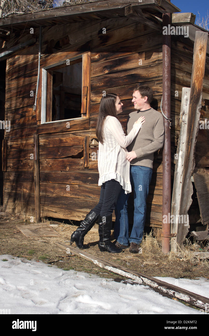 a young couple in love by an old barn Stock Photo - Alamy