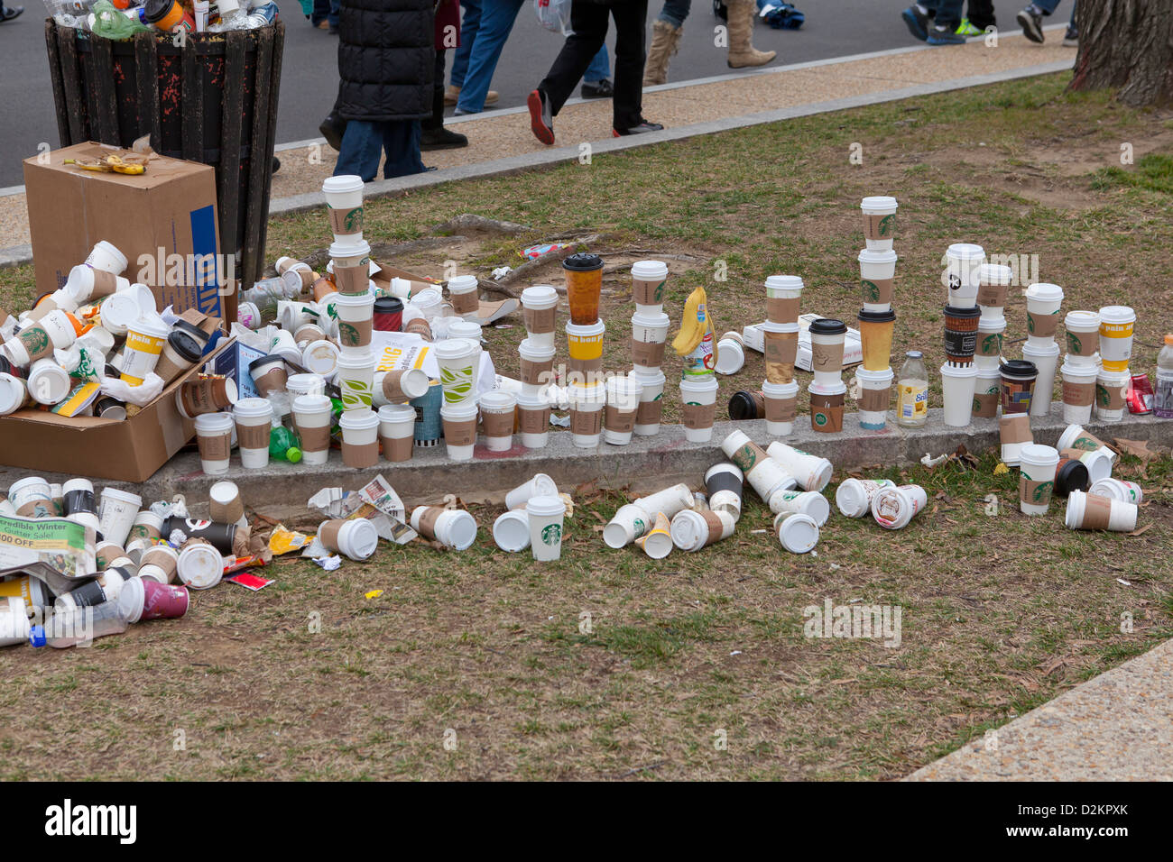 Discarded coffee cups overflowing from trash bin on public street Stock ...