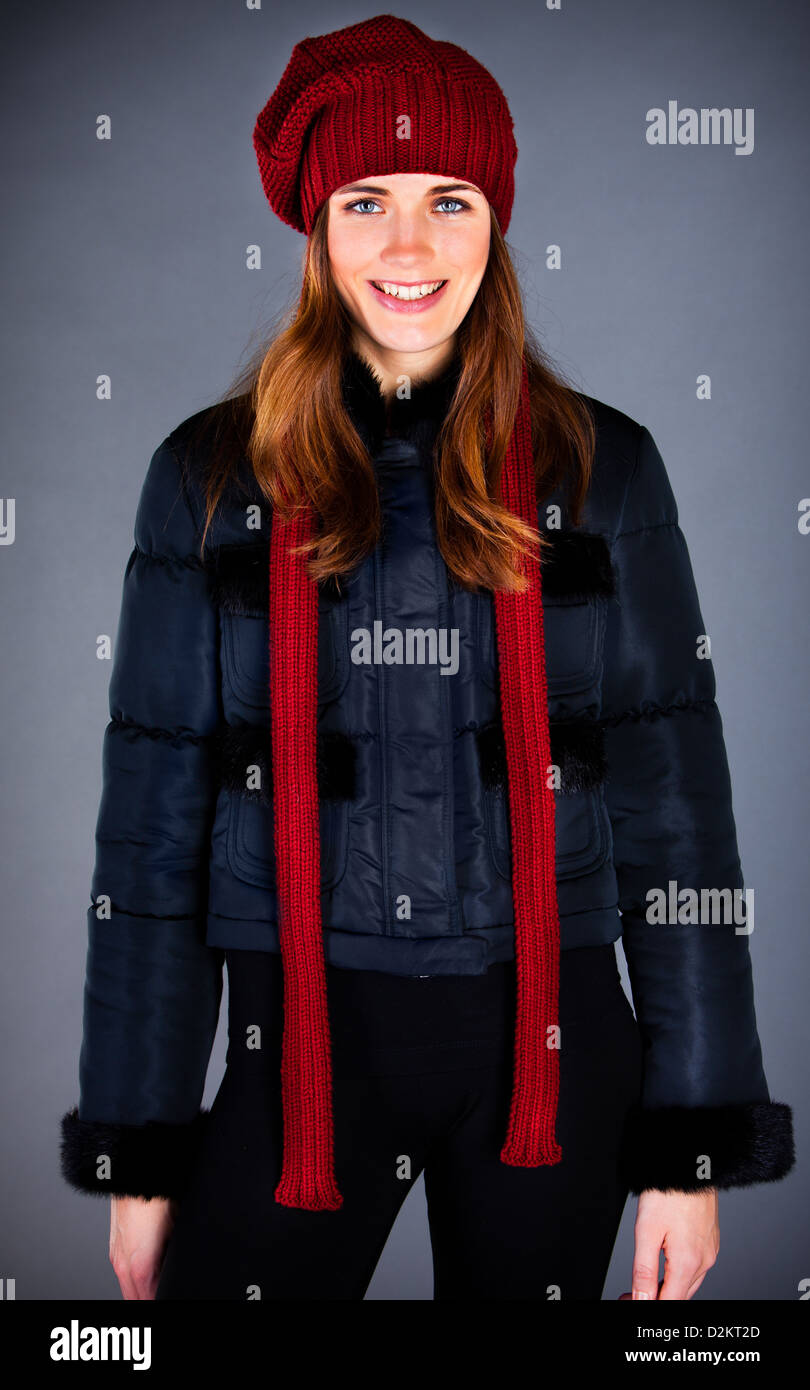 Portrait of the young girl in a winter cap on the dark Stock Photo - Alamy
