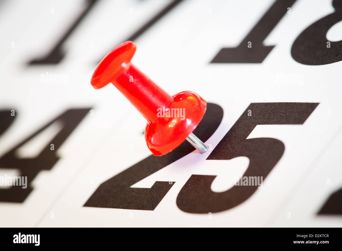 Push pin in calendar. Close up Stock Photo - Alamy