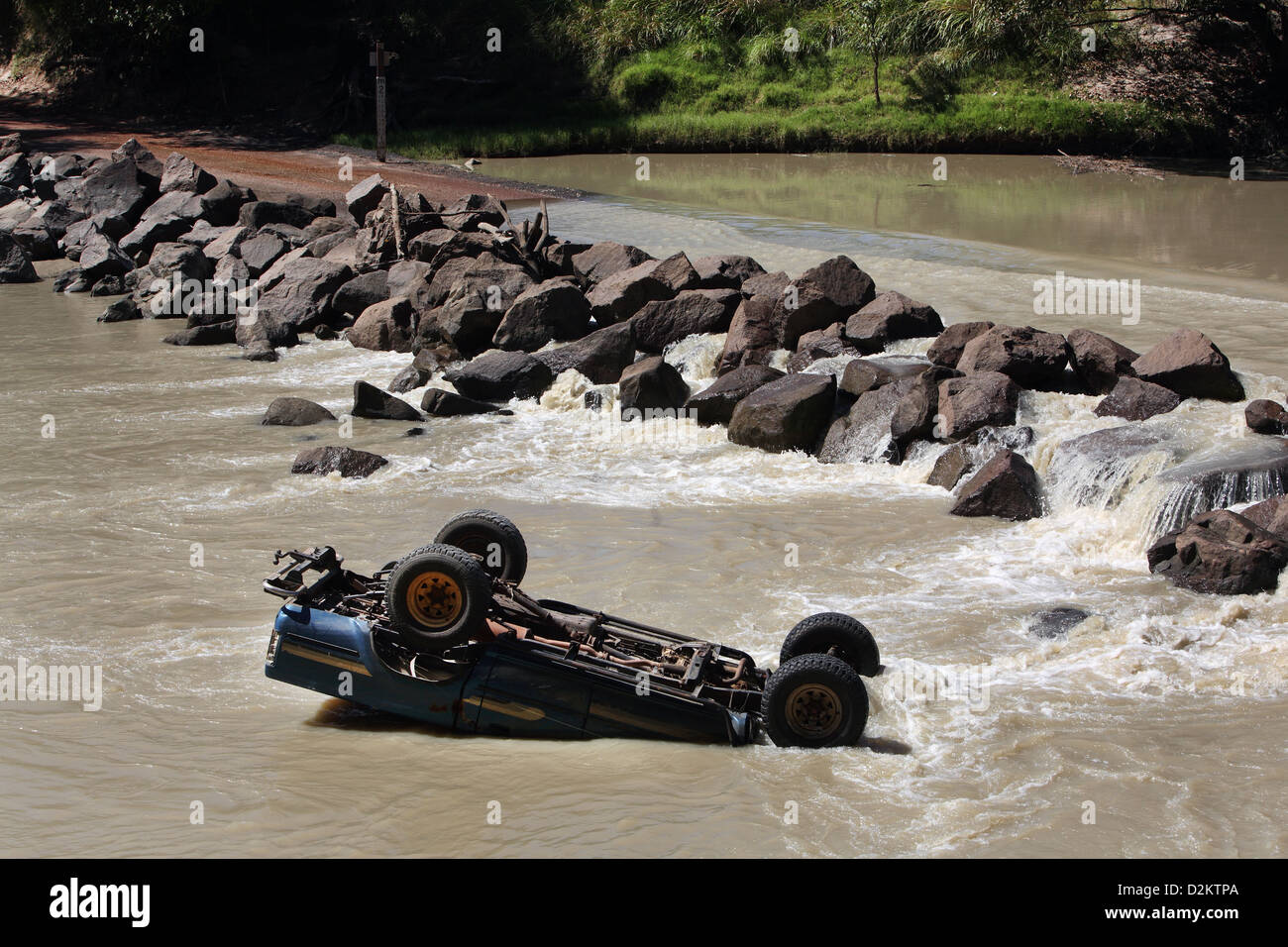 Car swept away by water at Cahill's crossing. Kakadu National Park ...