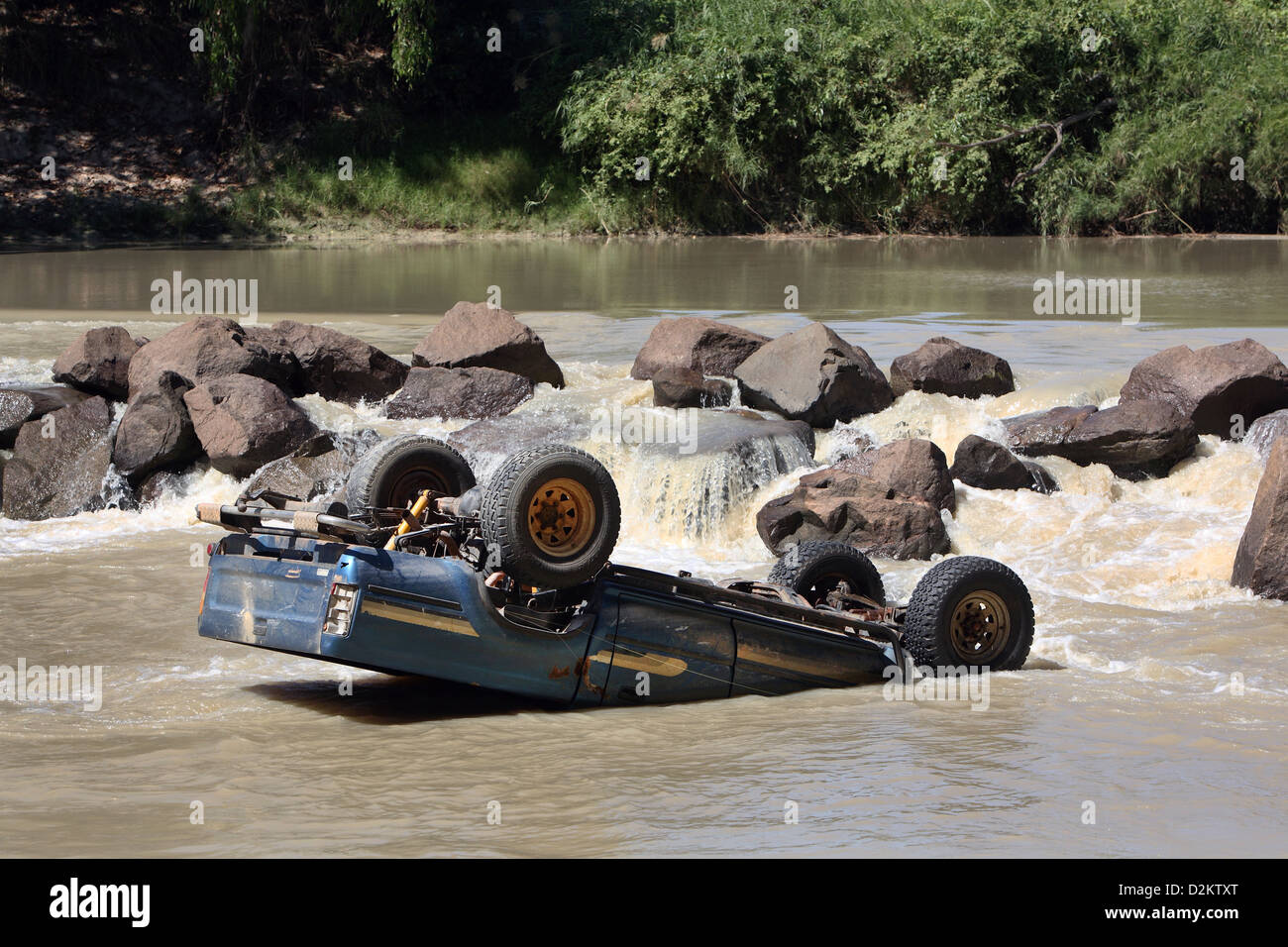Car swept away by water at Cahill's crossing. Kakadu National Park ...