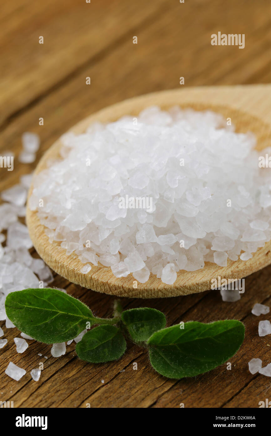 large sea salt on a wooden background Stock Photo - Alamy
