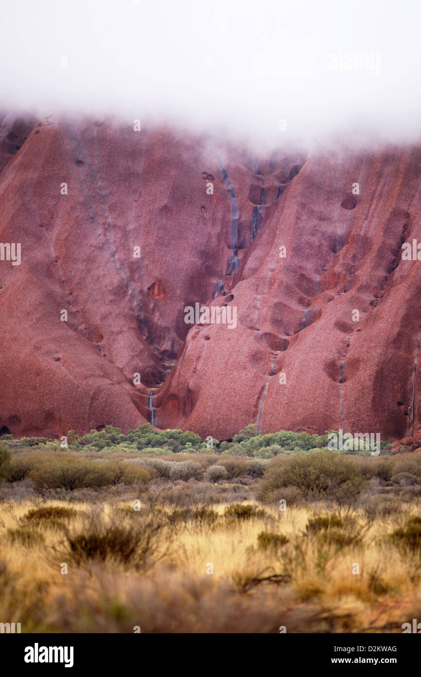 Very rare rain on Uluru (Ayers Rock), Central Australia Stock Photo - Alamy