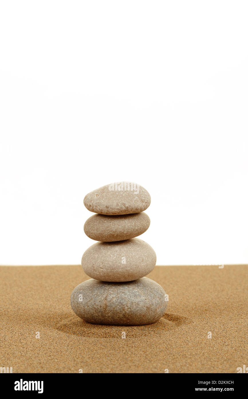 Balance zen stones in sand on white background Stock Photo - Alamy