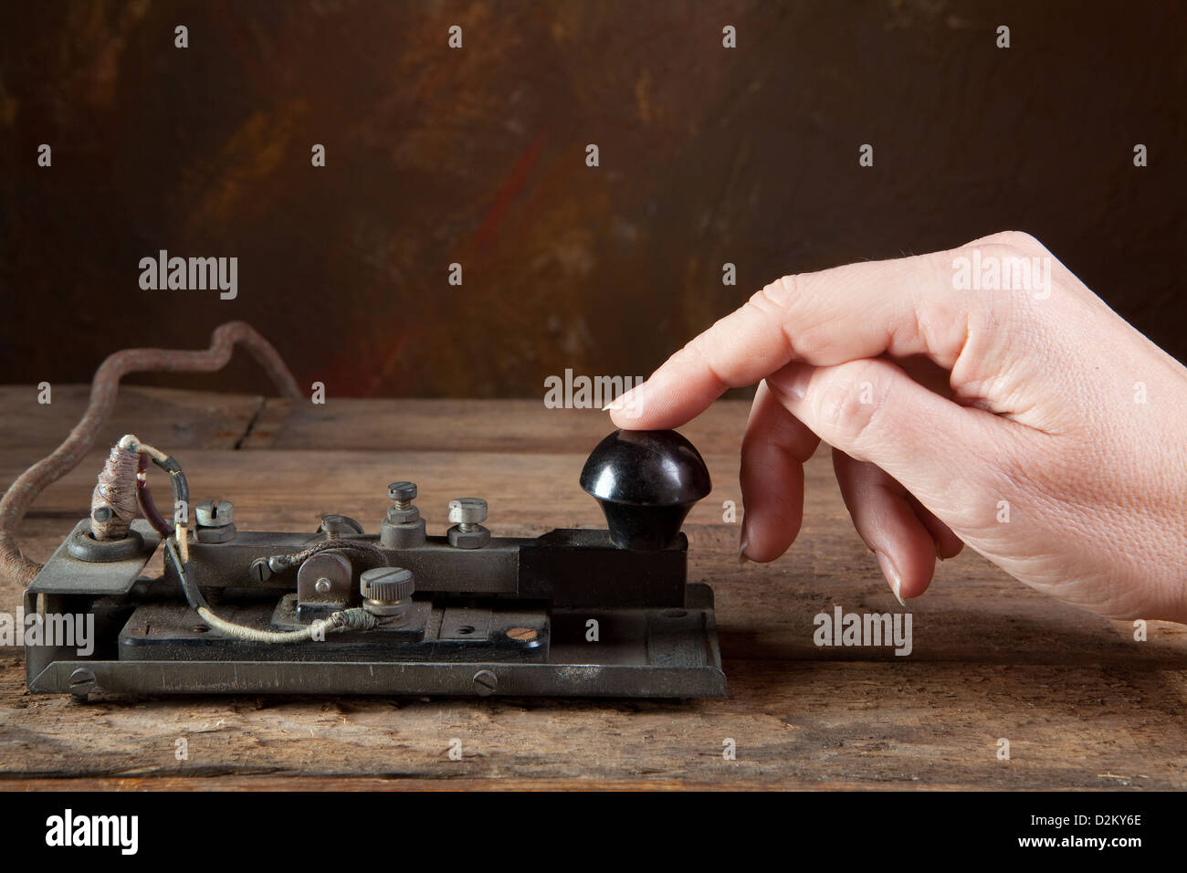 Hand tapping morse code on an antique telegraph Stock Photo - Alamy
