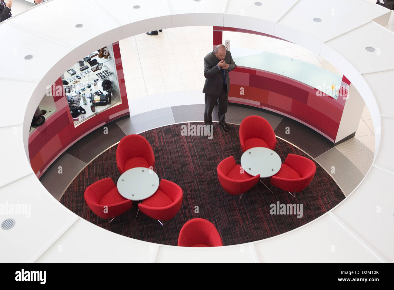 The view down into a waiting room where one man stands and waits ...