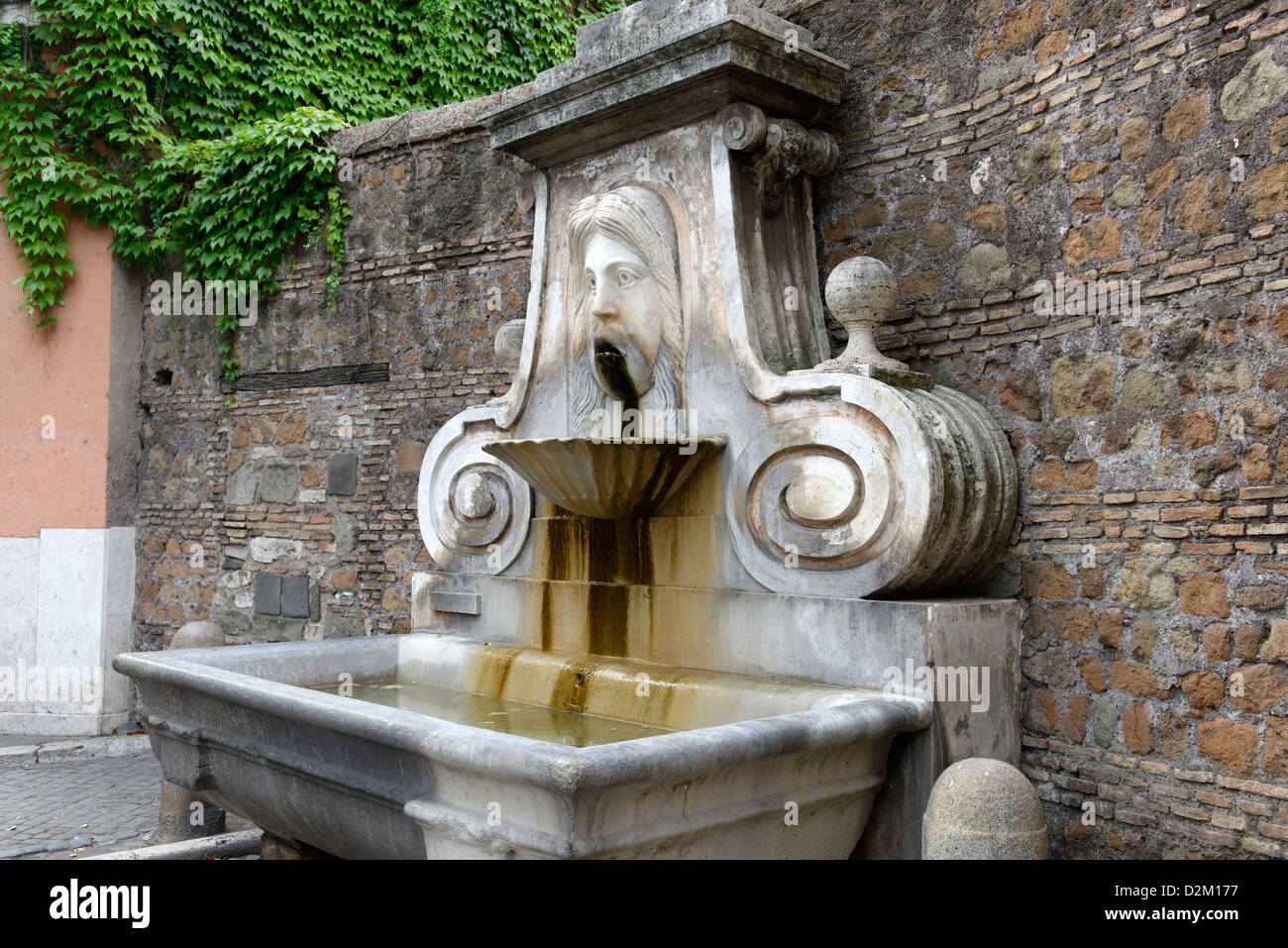 Rome. Italy. View of the charming walled Mascherone fountain located ...