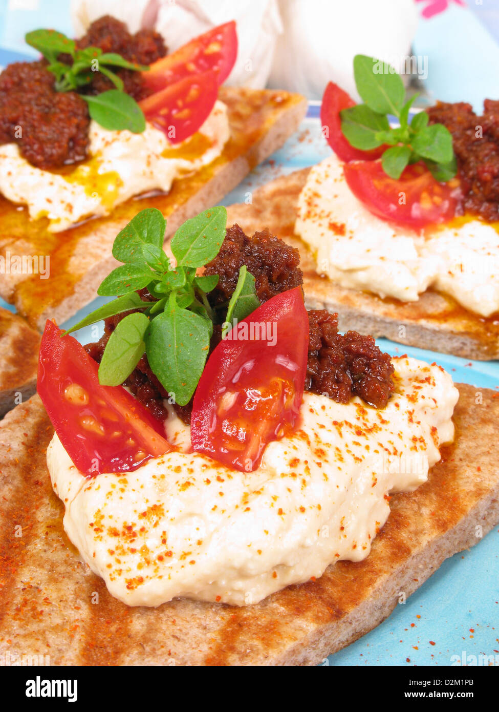 A Greek-style canape of griddled wholemeal pita bread topped with ...