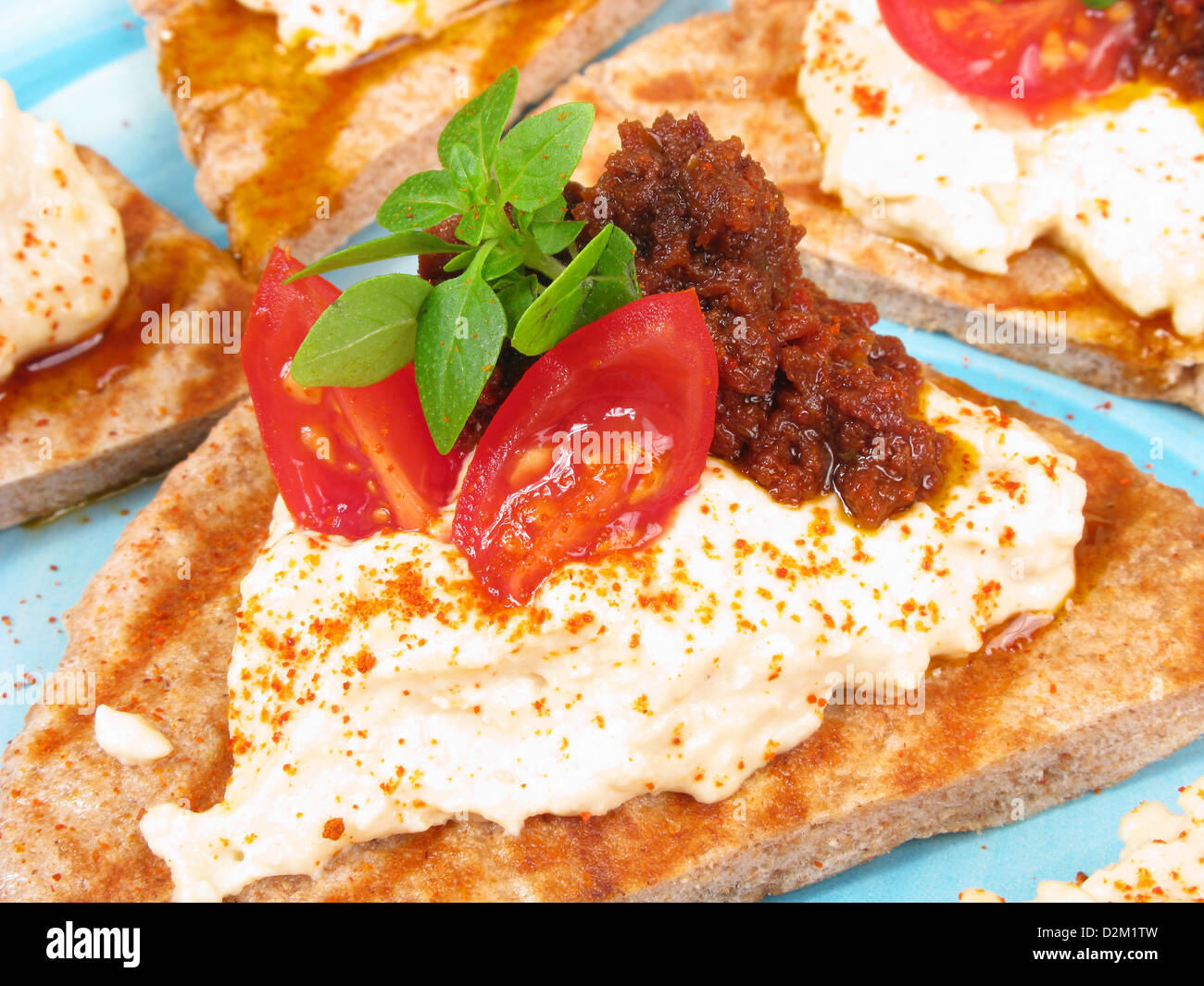 A Greek-style canape of griddled wholemeal pita bread topped with ...