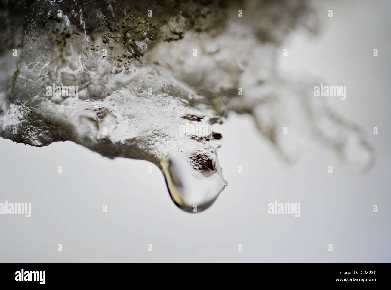 A water drop falls from melting ice in Munich, Germany, 28 January 2013 ...