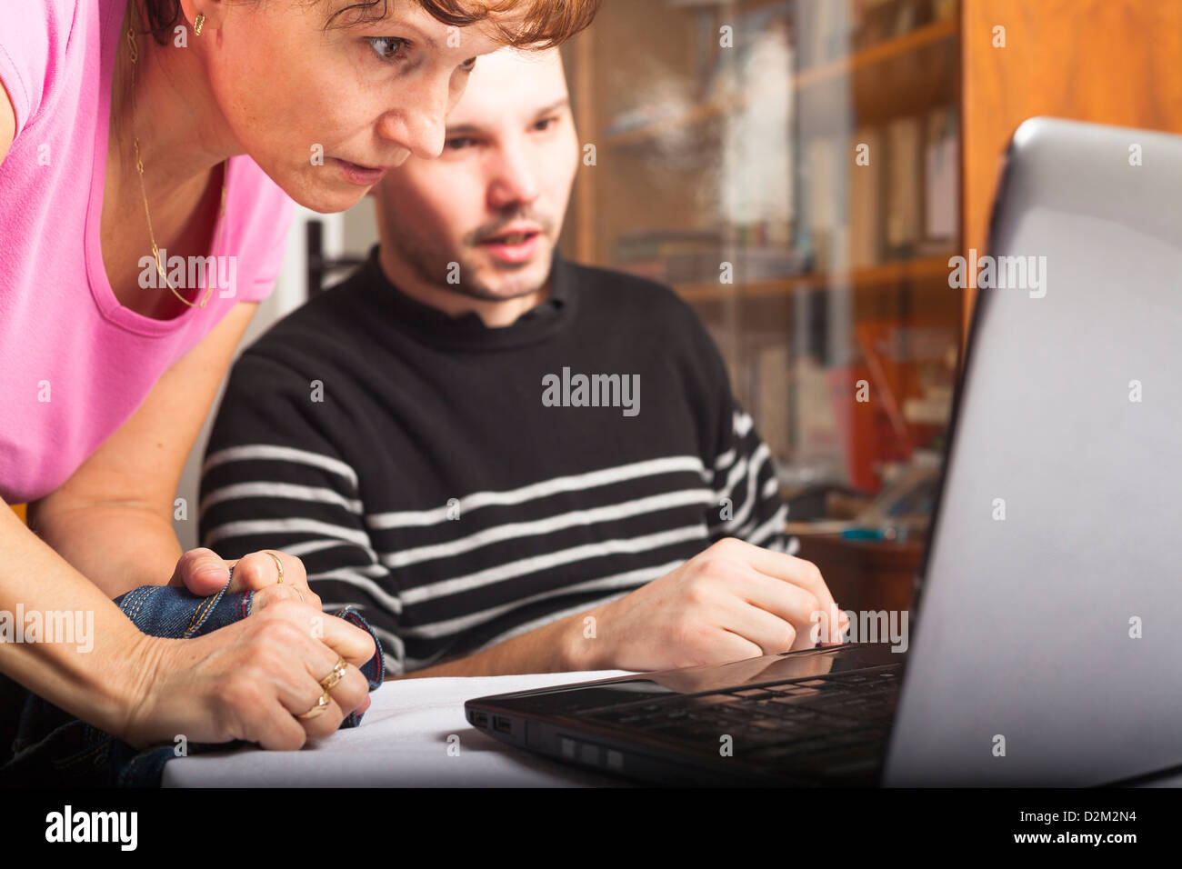 Happy aged woman working laptop hi-res stock photography and images - Alamy