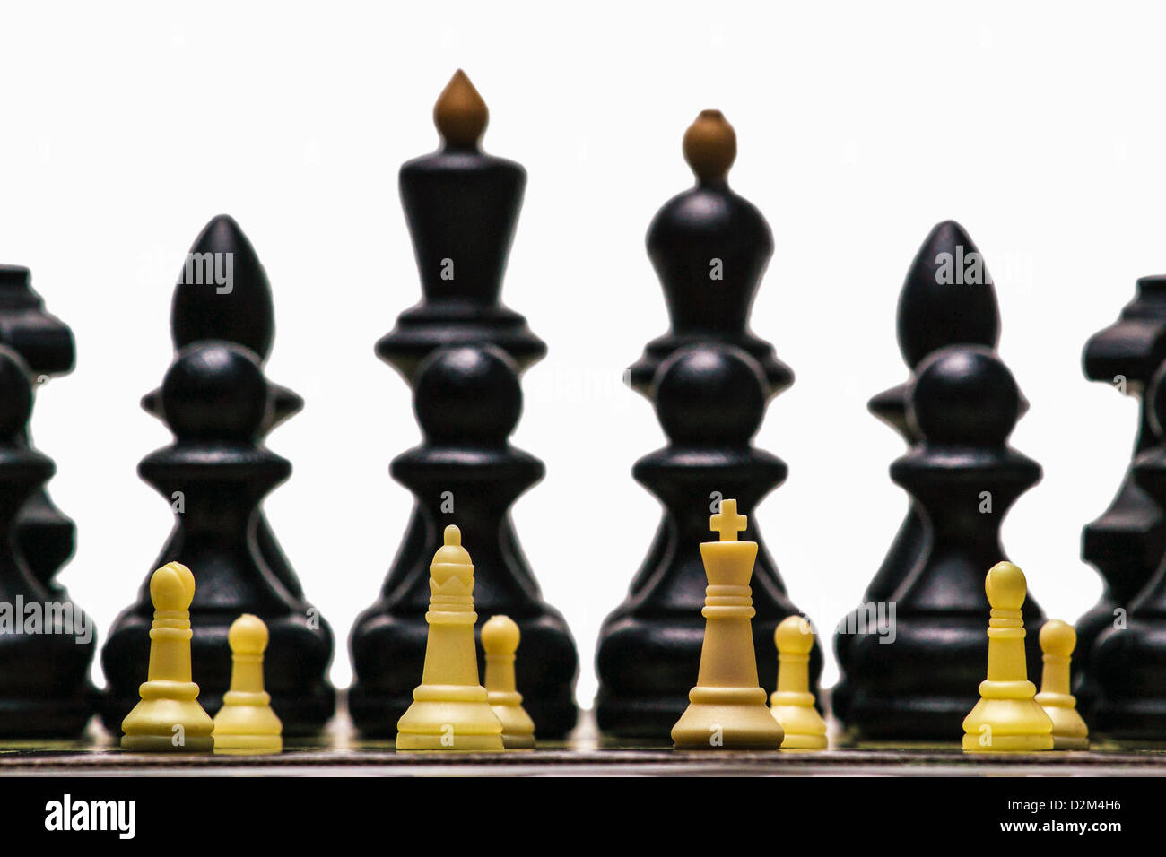 Superpower aggression. A set of small white chess pieces against the ...