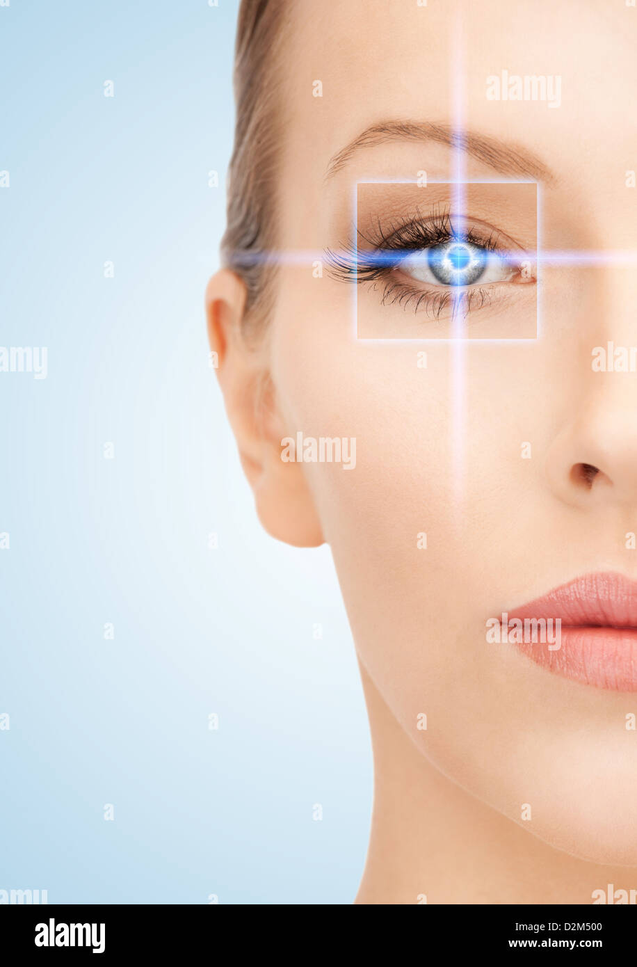 beautiful woman pointing to eye Stock Photo - Alamy