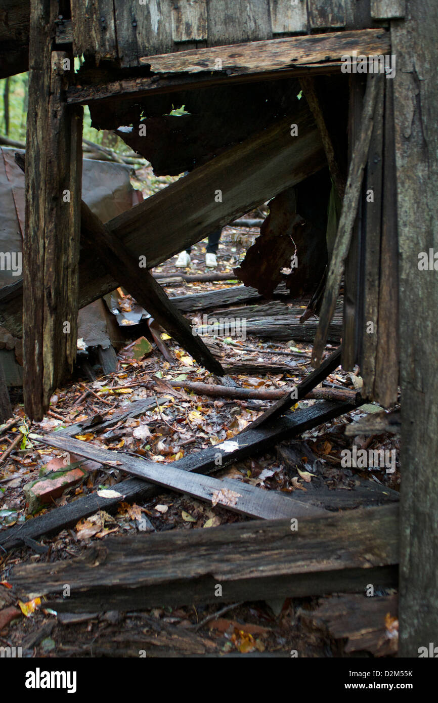Wooden structure falling down in woods Stock Photo - Alamy