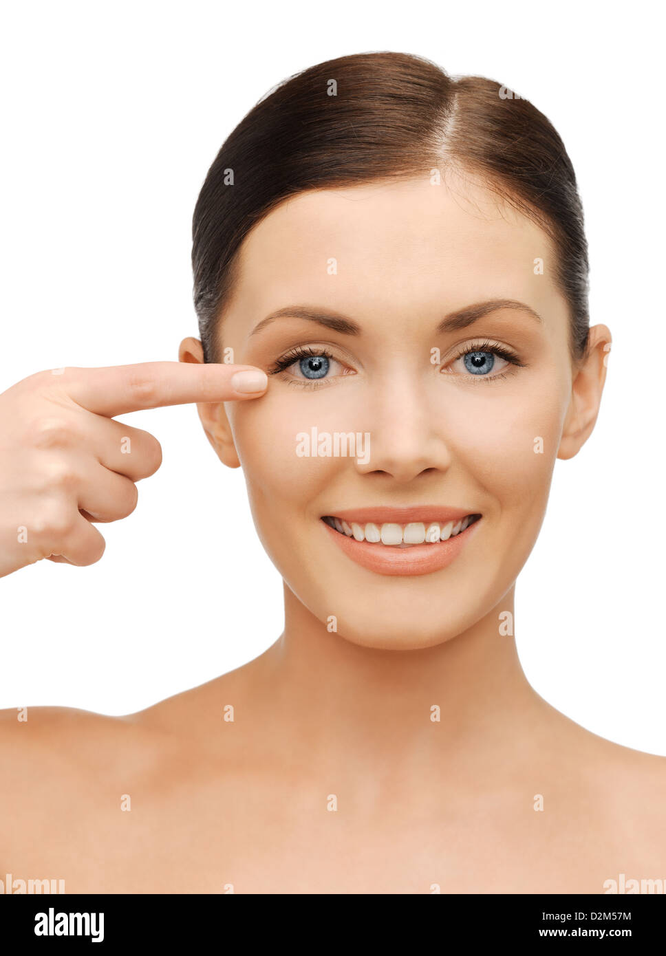 beautiful woman pointing to eye Stock Photo - Alamy