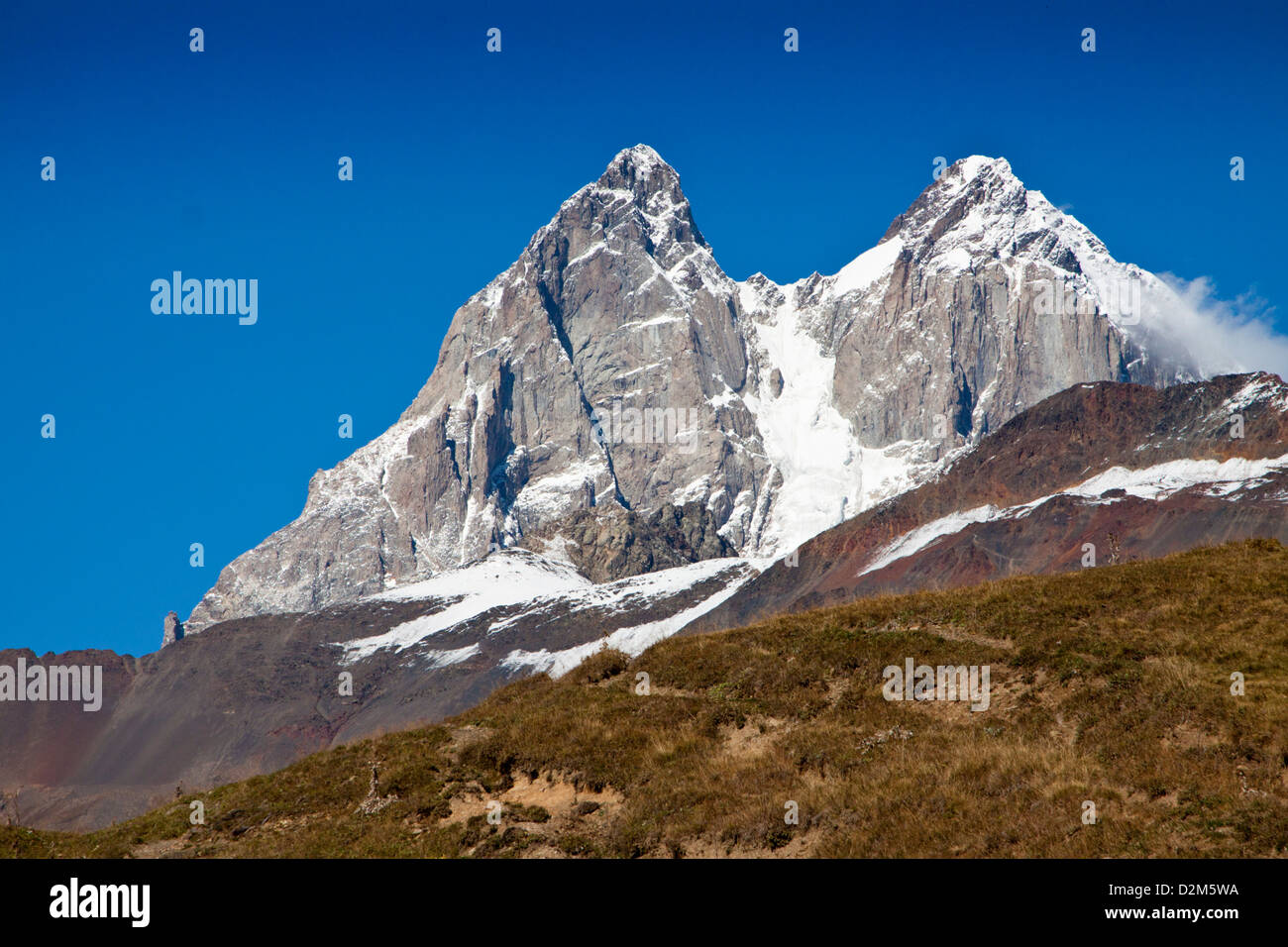 Twin peaks of Mount Ushba in Georgia's Svaneti region. Ushba is ...