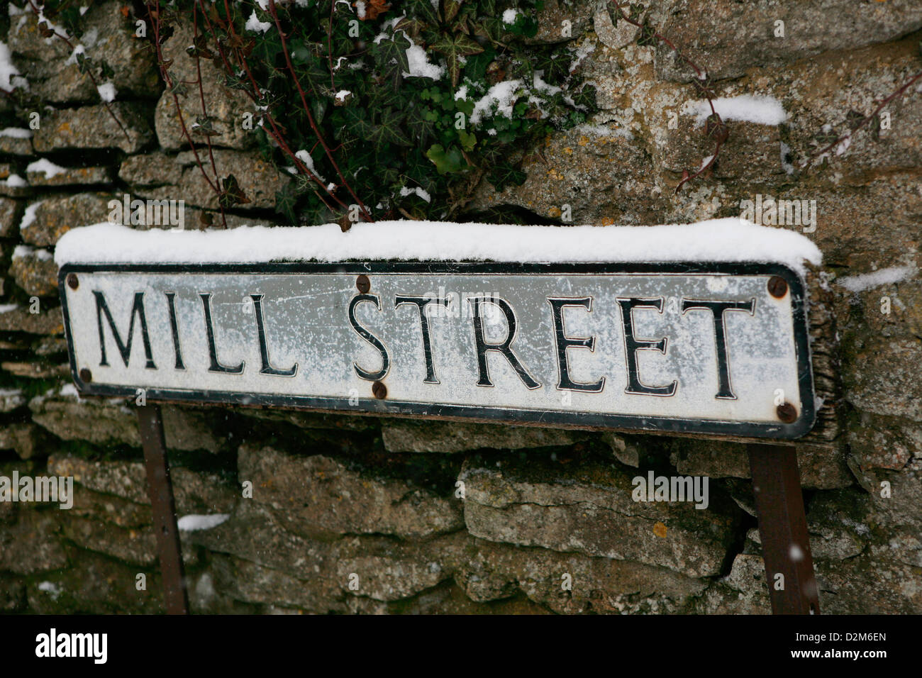Mill street road sign, Kidlington, Oxfordshire, England. Snow is ...