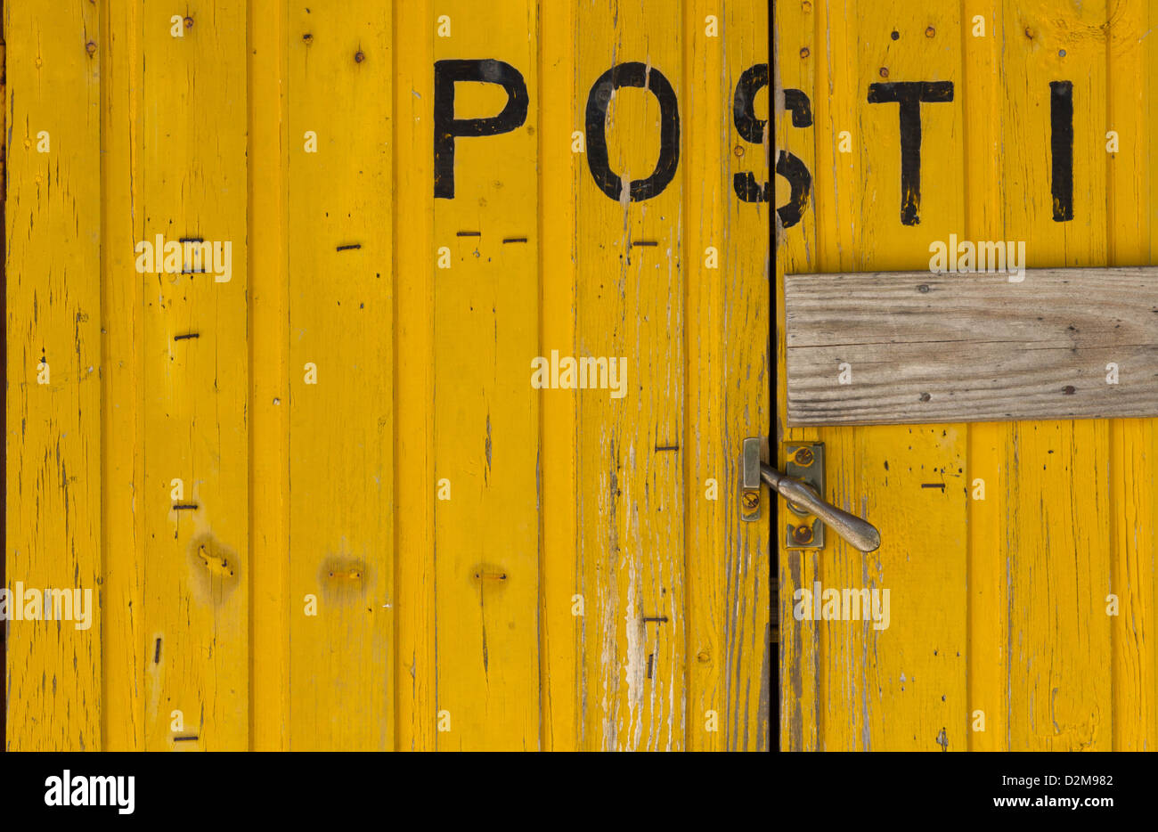 Worn rural wooden post box on an island in the Finnish archipelago ...