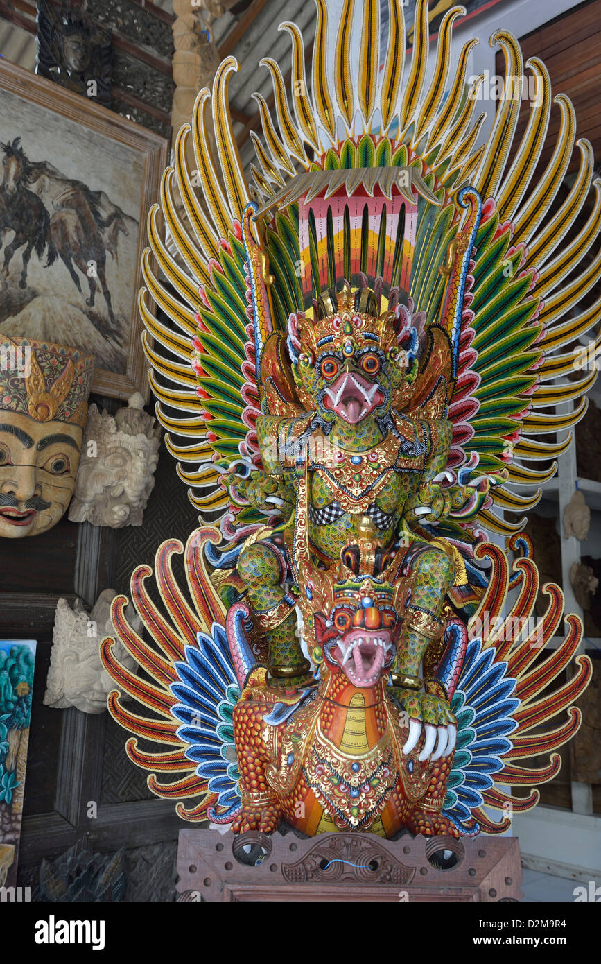 A richly woodcarved Garuda in one of the countless handicraft shop ...