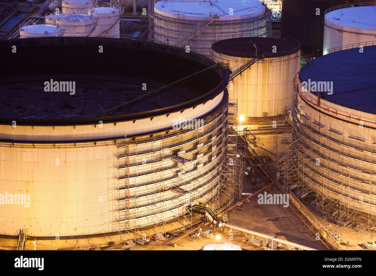 Oil tanks at night Stock Photo - Alamy