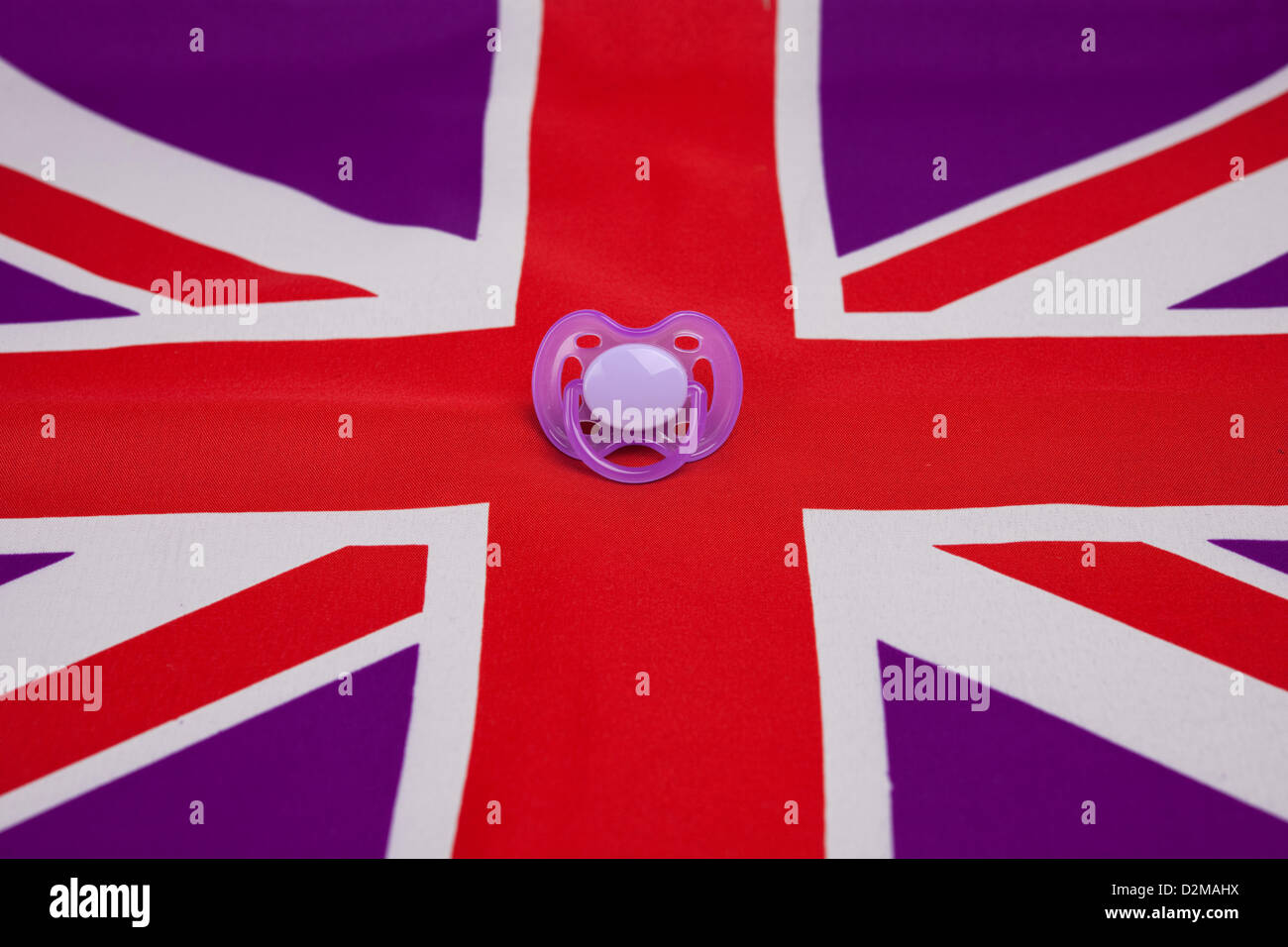 Symbolic picture of a pink pacifier on the british flag Stock Photo - Alamy