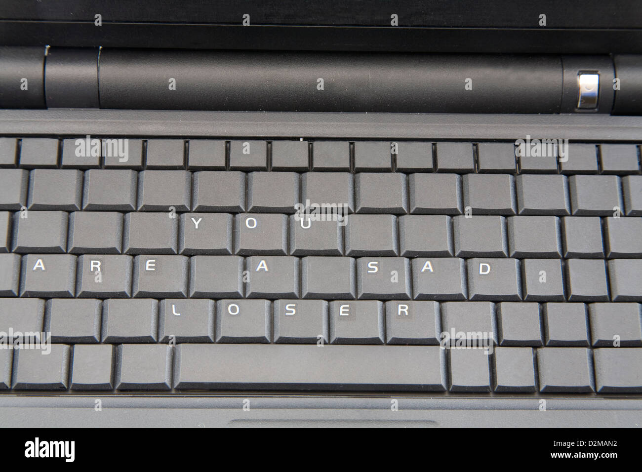 Studio Spiteful comment on keyboard as form of cyber bullying Stock ...