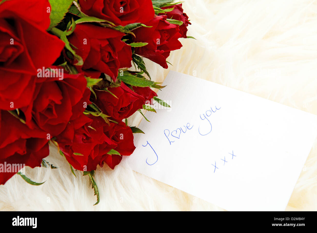 Romantic note: I love with red roses Stock Photo - Alamy