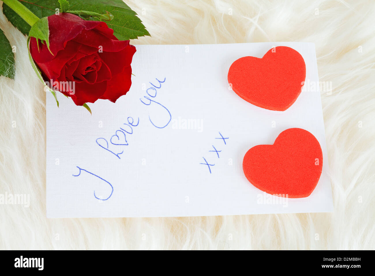 Romantic note: I love with red rose and hearts Stock Photo - Alamy