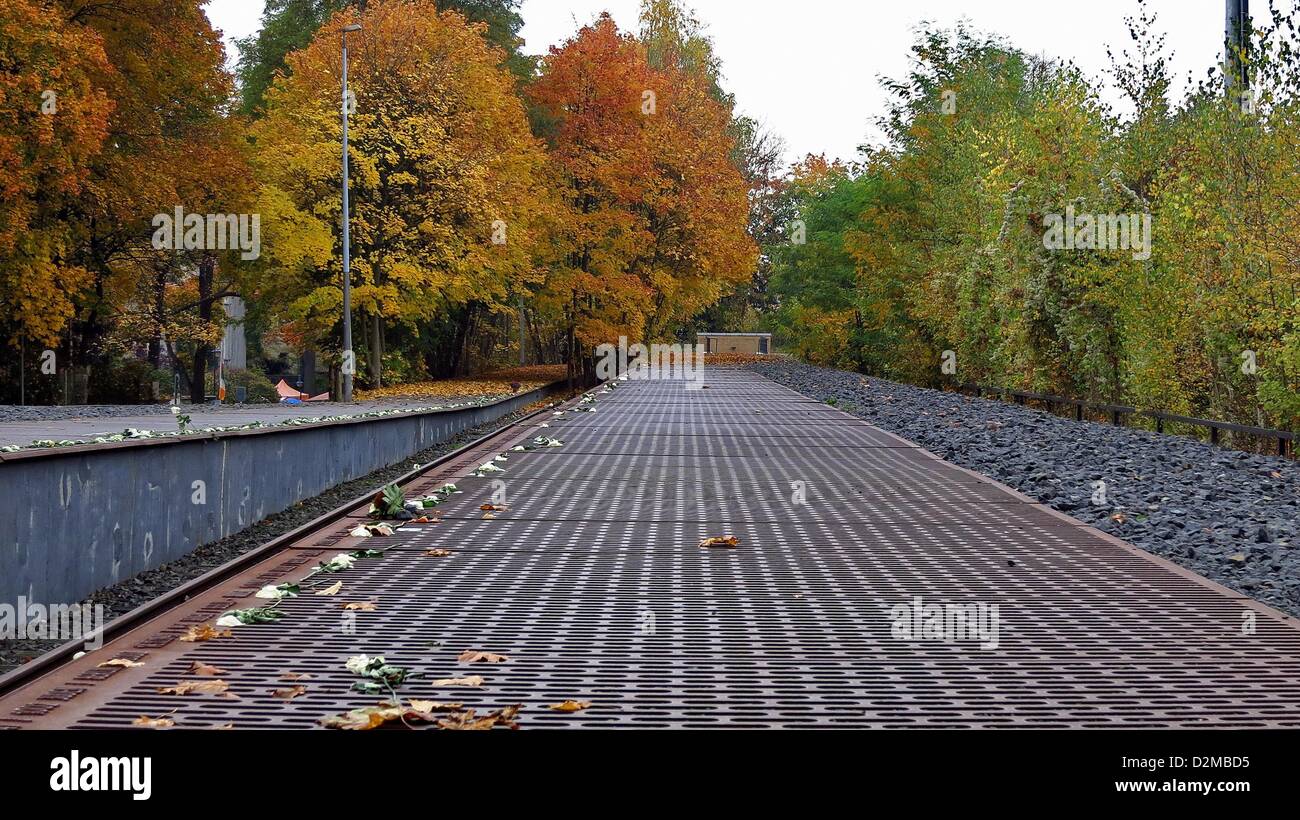 White roses lie on the steel plates of the Platform 17 memorial site at ...