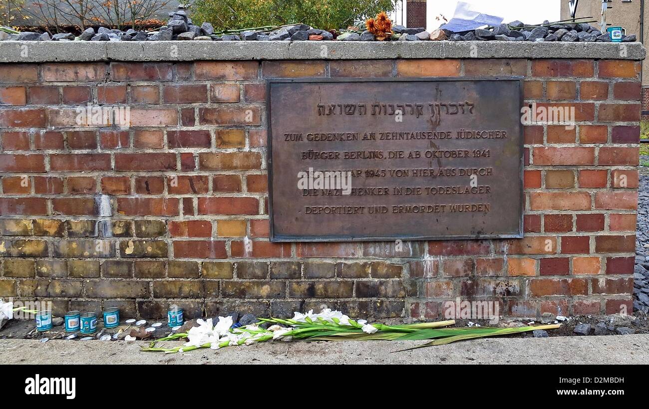 A memorial plate hangs attached to a red brick wall at the Platform 17 ...