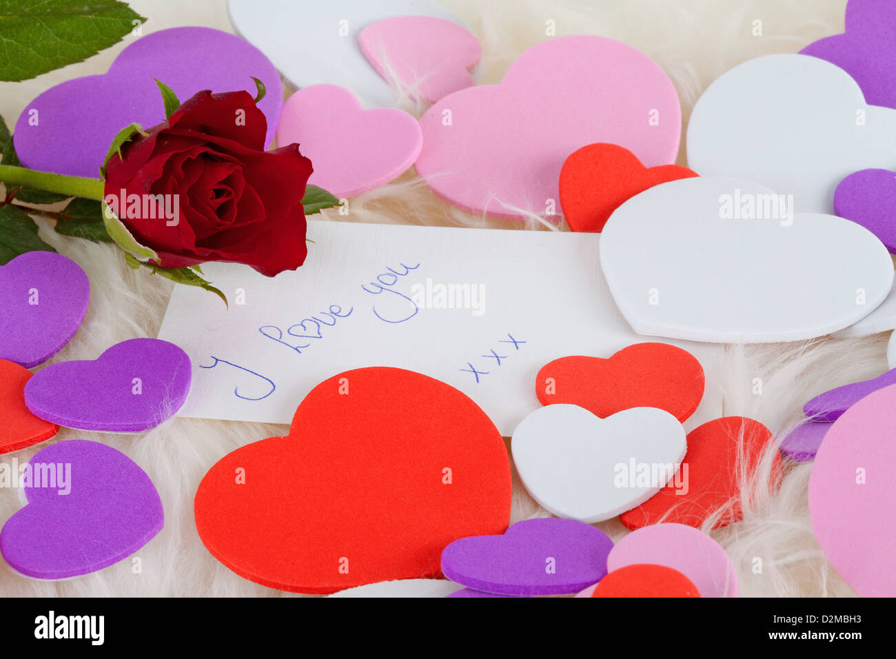 Romantic note: I love with red rose and hearts Stock Photo - Alamy