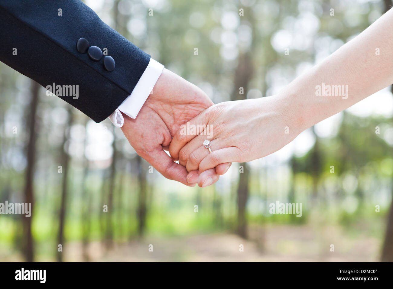 Couple hand in hand, love concept Stock Photo - Alamy