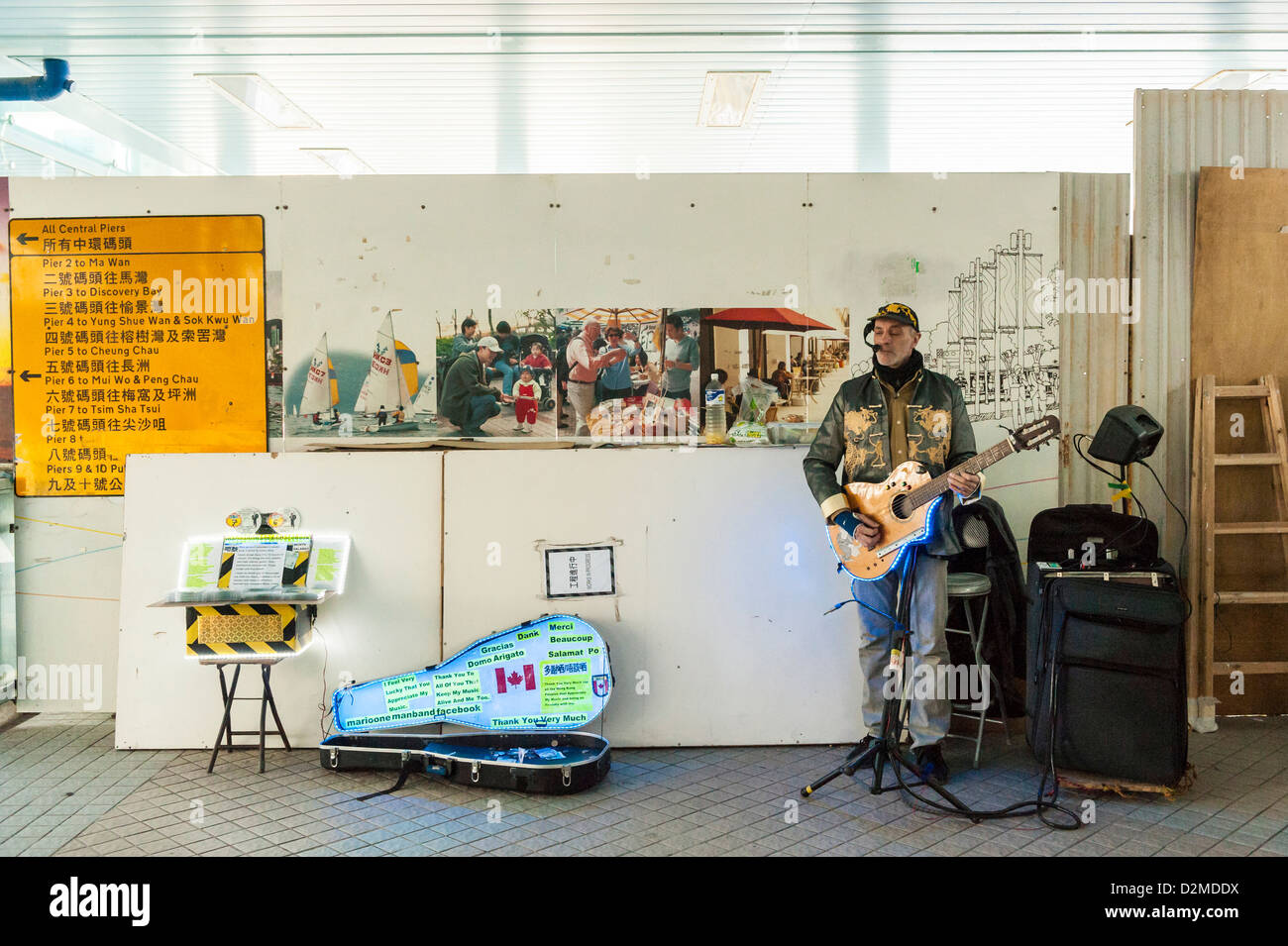 Busker street performer in Hong Kong Stock Photo - Alamy