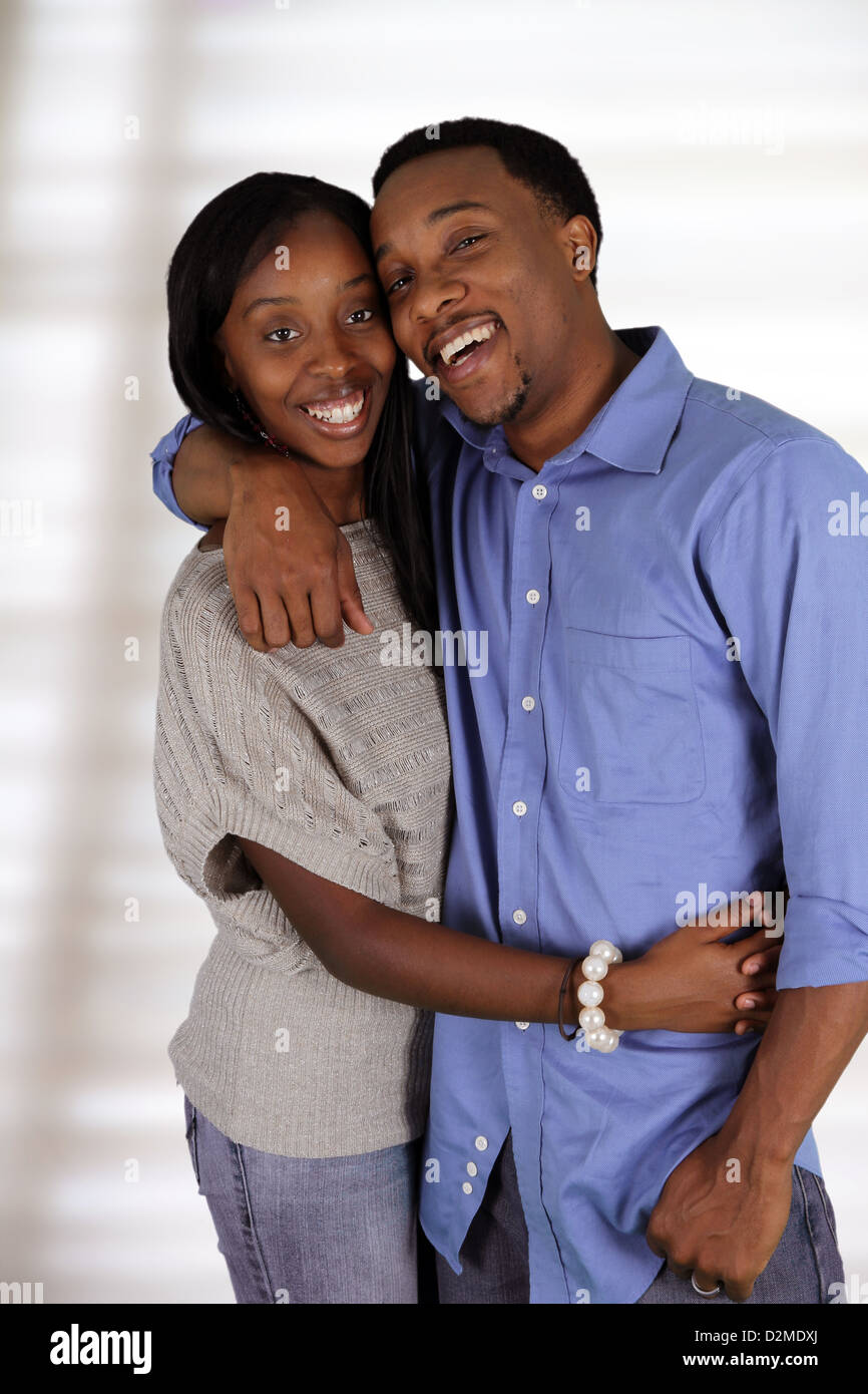 Man and woman posing together inside their home Stock Photo - Alamy