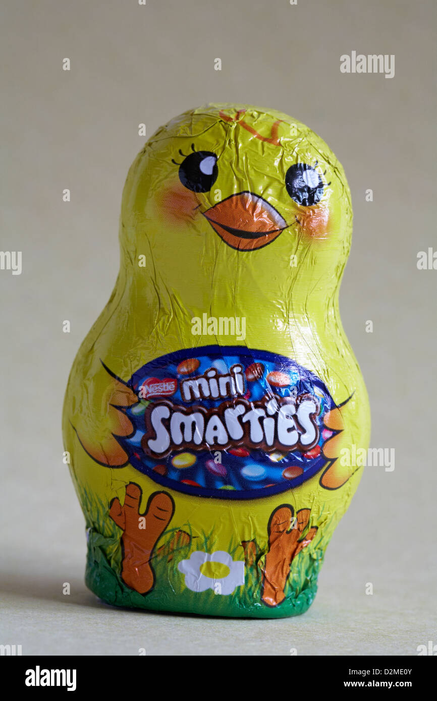 Nestlé mini Smarties Easter chick chocolate isolated on pale yellow ...