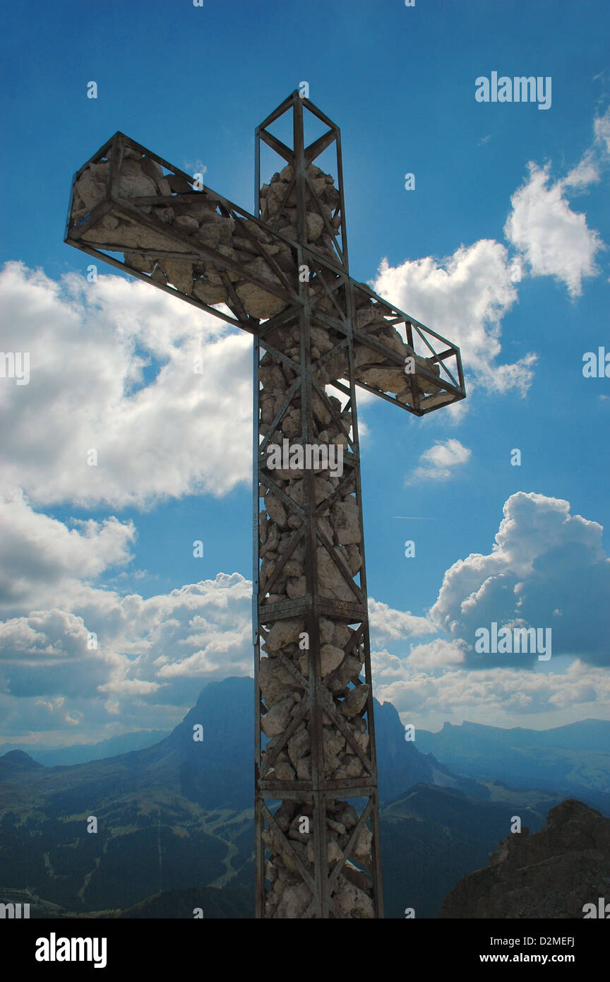 Steel cross filled with rocks on Sass Pordoi of the Sella Group in ...