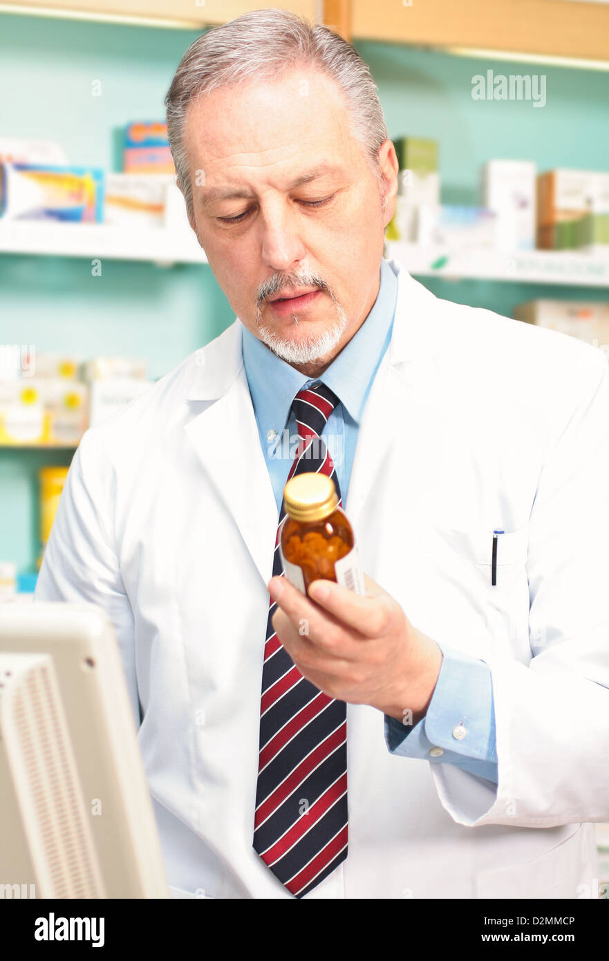 Pharmacist at work in his pharmacy Stock Photo - Alamy