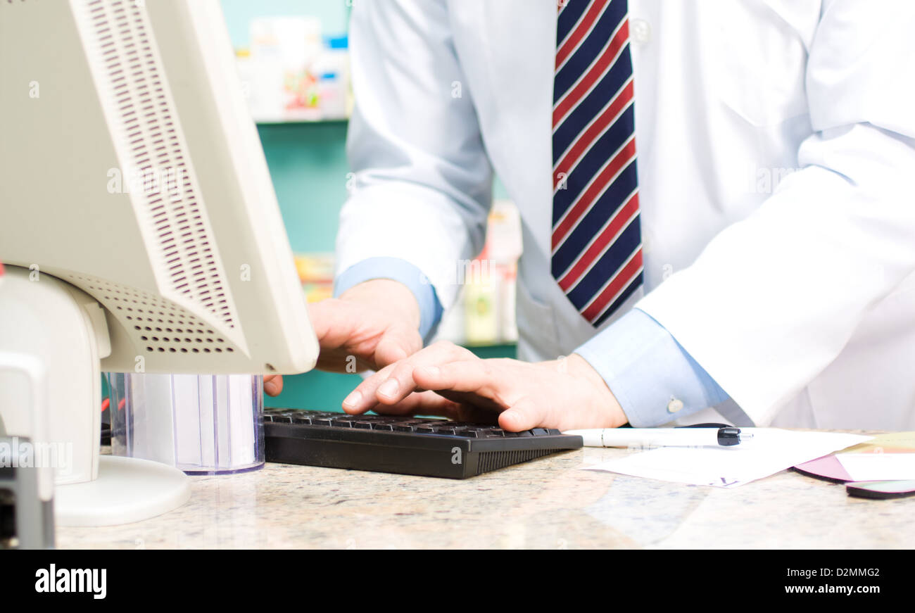 Pharmacist at work in his pharmacy Stock Photo - Alamy