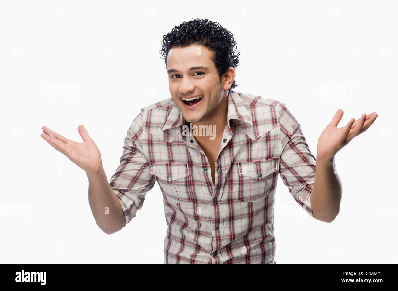 Portrait of a man shrugging and smiling Stock Photo - Alamy