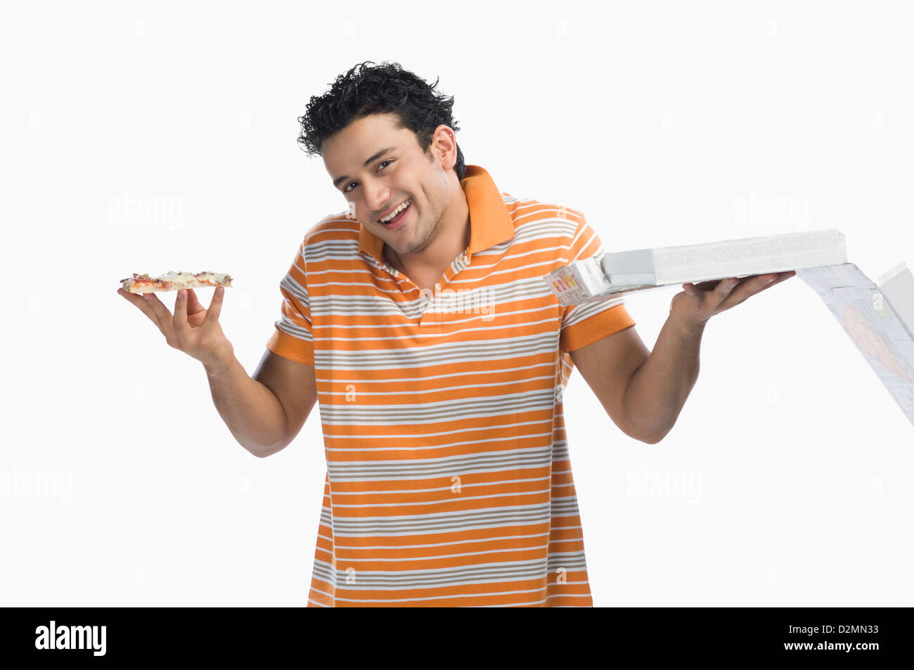 Portrait of a man eating pizza and smiling Stock Photo - Alamy
