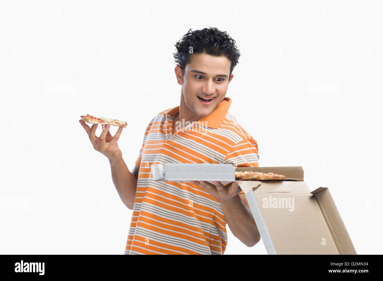 Close-up of a man looking at pizza Stock Photo - Alamy